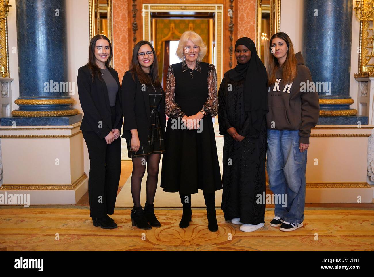 Queen Camilla, Patron of SafeLives, (centre) with young pioneer ...