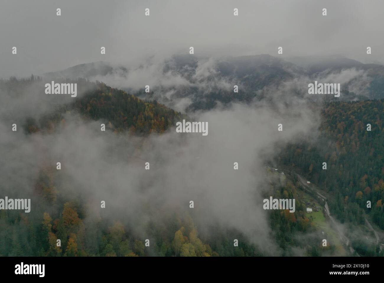Aerial view of mountains covered with fog Stock Photo - Alamy