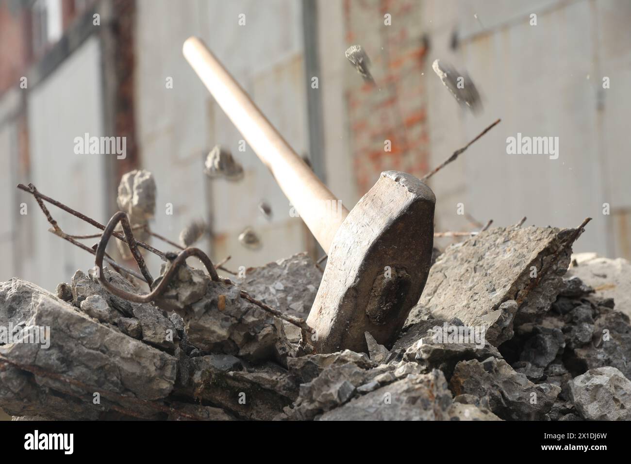Sledgehammer on pile of broken stones outdoors, closeup Stock Photo - Alamy