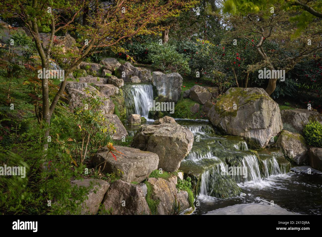 Waterfall in Kyoto Garden, a Japanese garden in Holland Park, London, UK. Holland Park is a ...