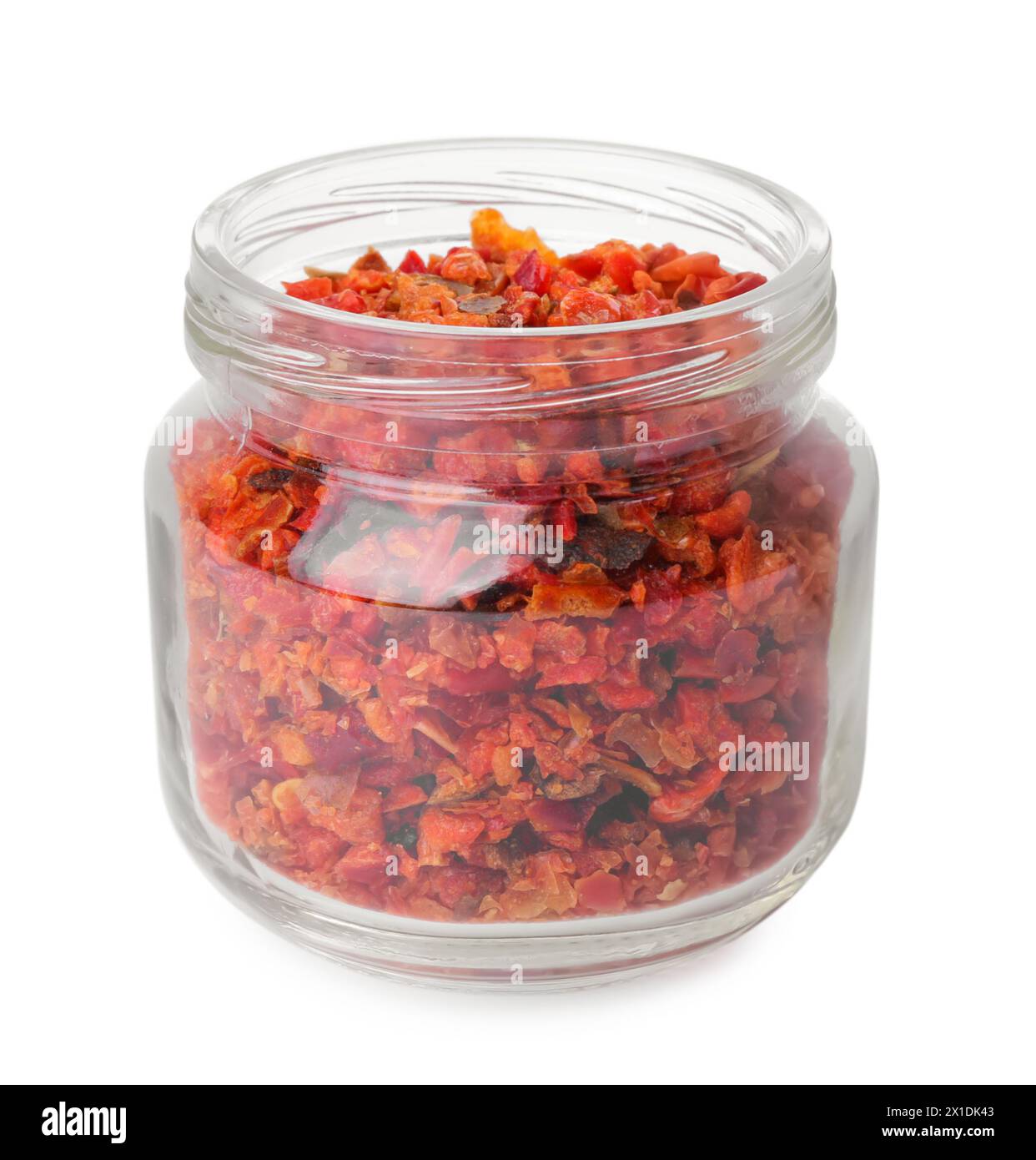 Aromatic spice. Red chili pepper flakes in jar isolated on white Stock ...