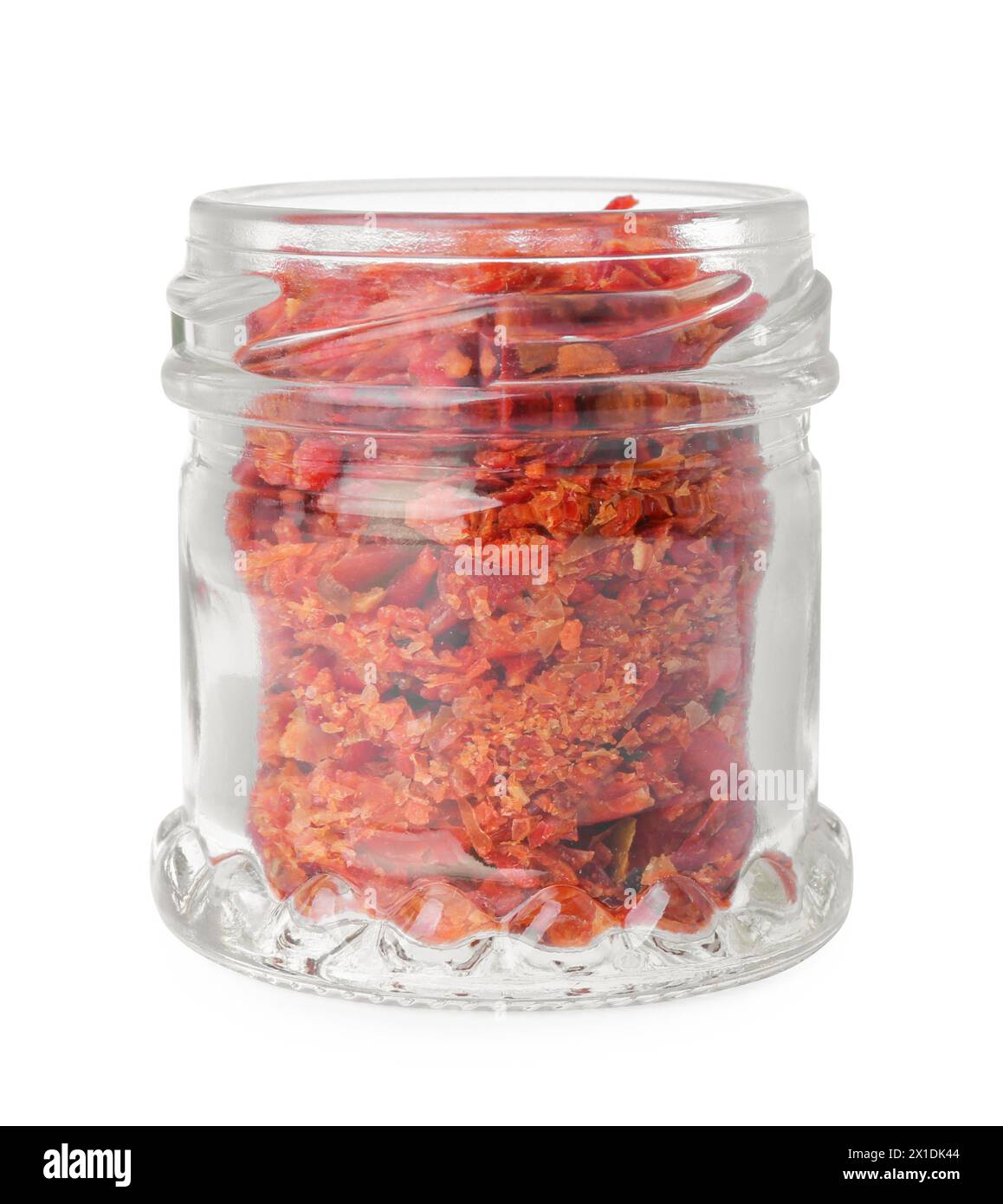 Aromatic spice. Red chili pepper flakes in jar isolated on white Stock ...