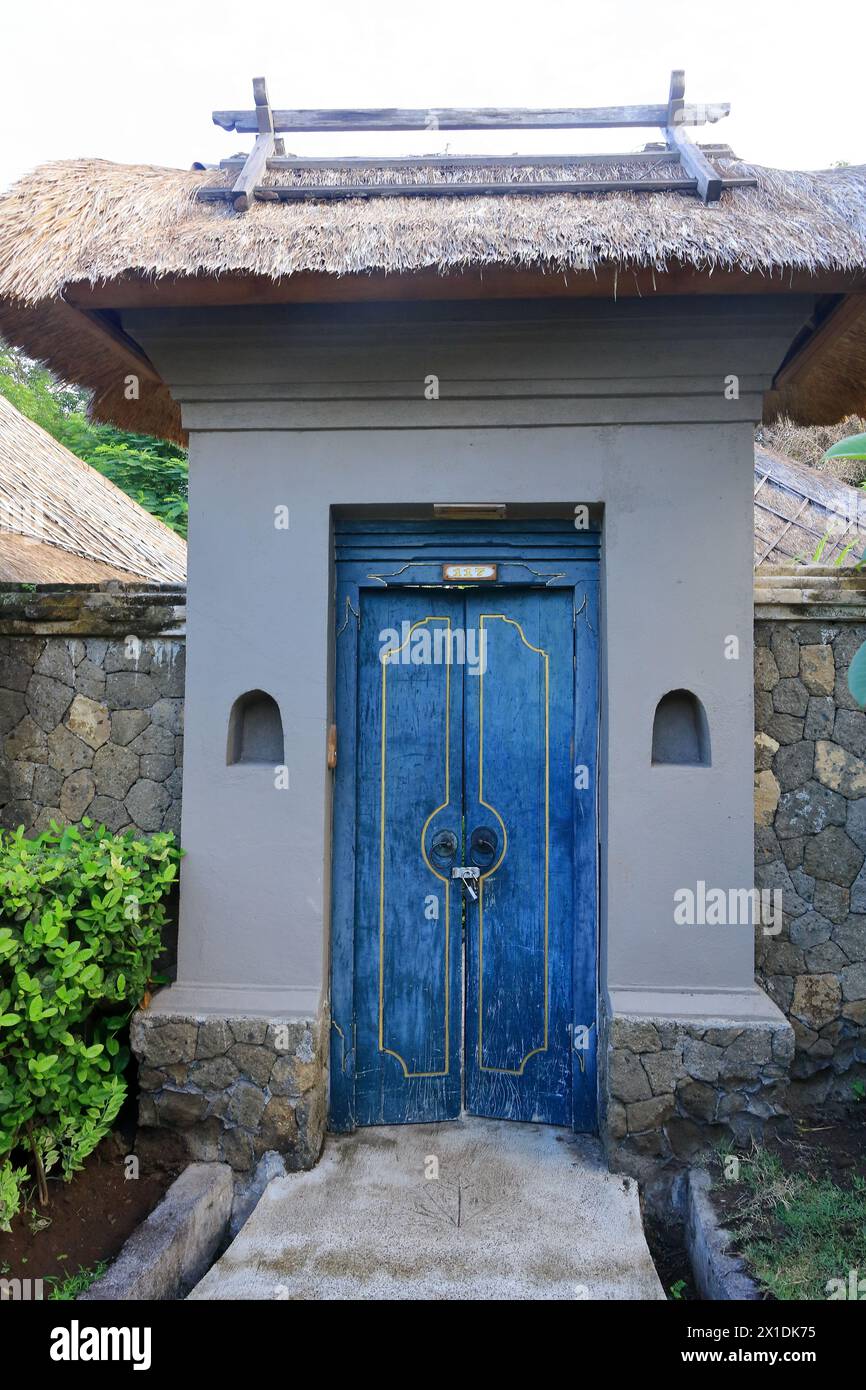 a Traditional balinese handmade carved wooden door. Bali style ...