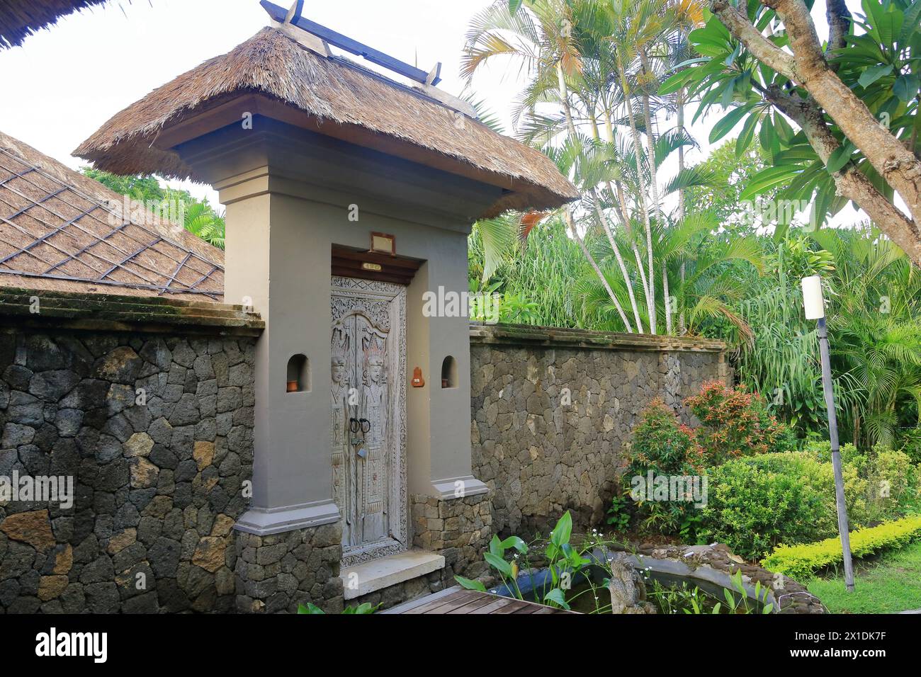 a Traditional balinese handmade carved wooden door. Bali style ...