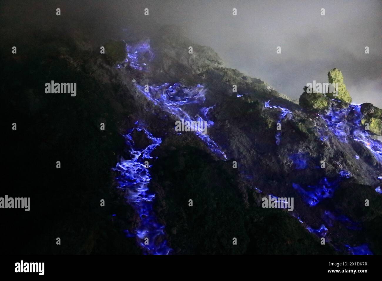 the blue fire along the sulfur path in Ijen Volcano, Java in Indonesia ...