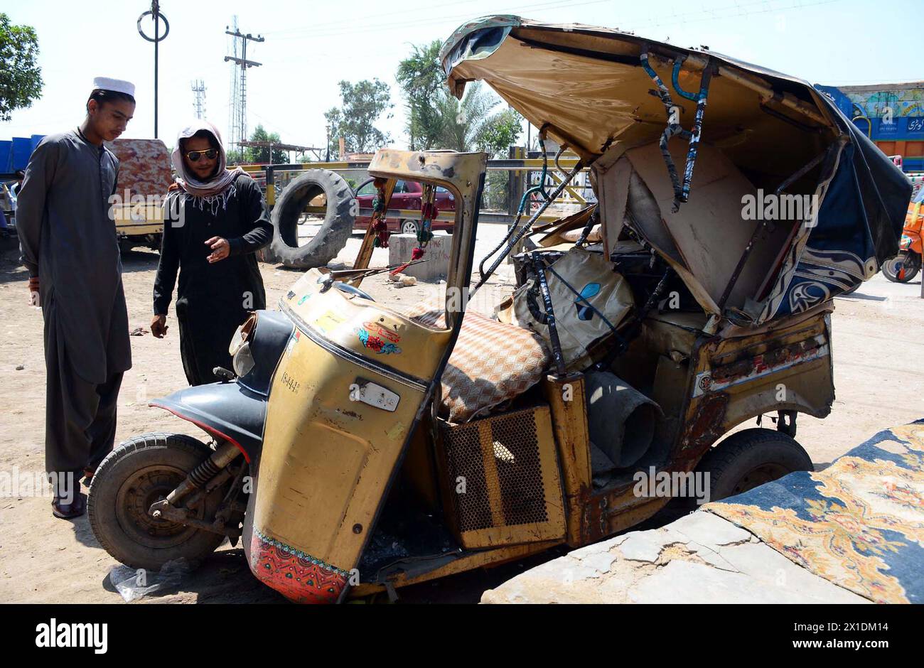 View of rickshaw after traffic accident due to damaged road, showing ...