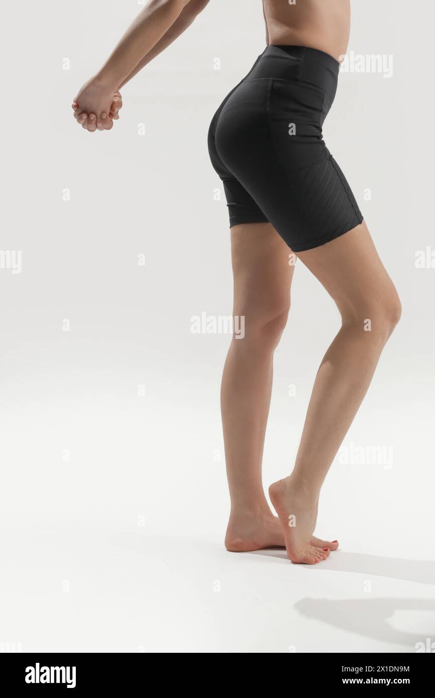 Young woman practicing stretching yoga positions, wellbeing and self ...