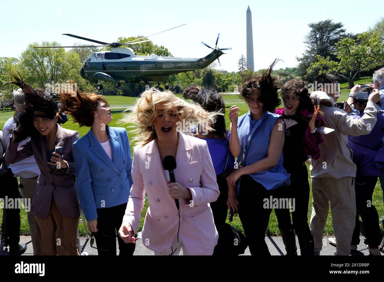Washington, United States. 16th Apr, 2024. Reporters are blown by the ...