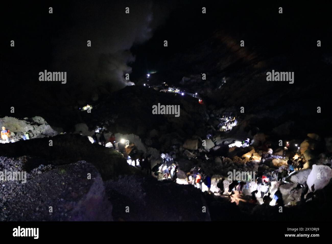 Mount Ijen, Java in Indonesia - February 04 2024: people walk at night ...