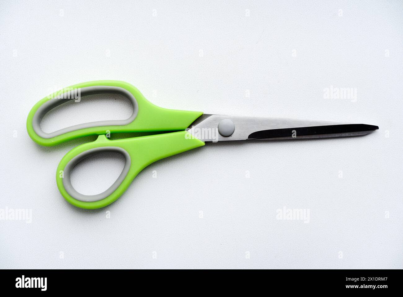Sewing scissors on a white background. Green scissors Stock Photo - Alamy