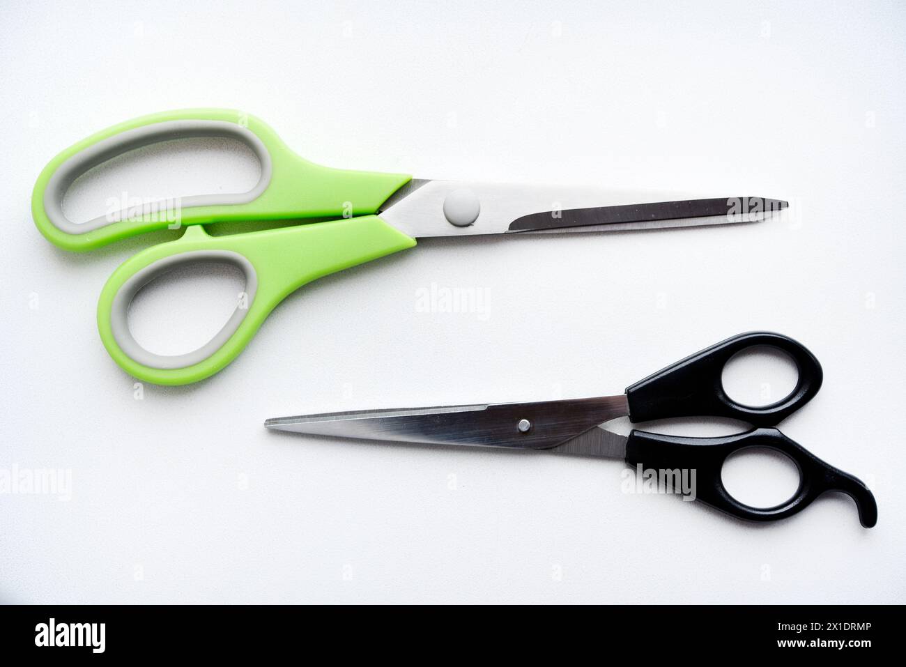 Sewing scissors on a white background. Green scissors Stock Photo - Alamy