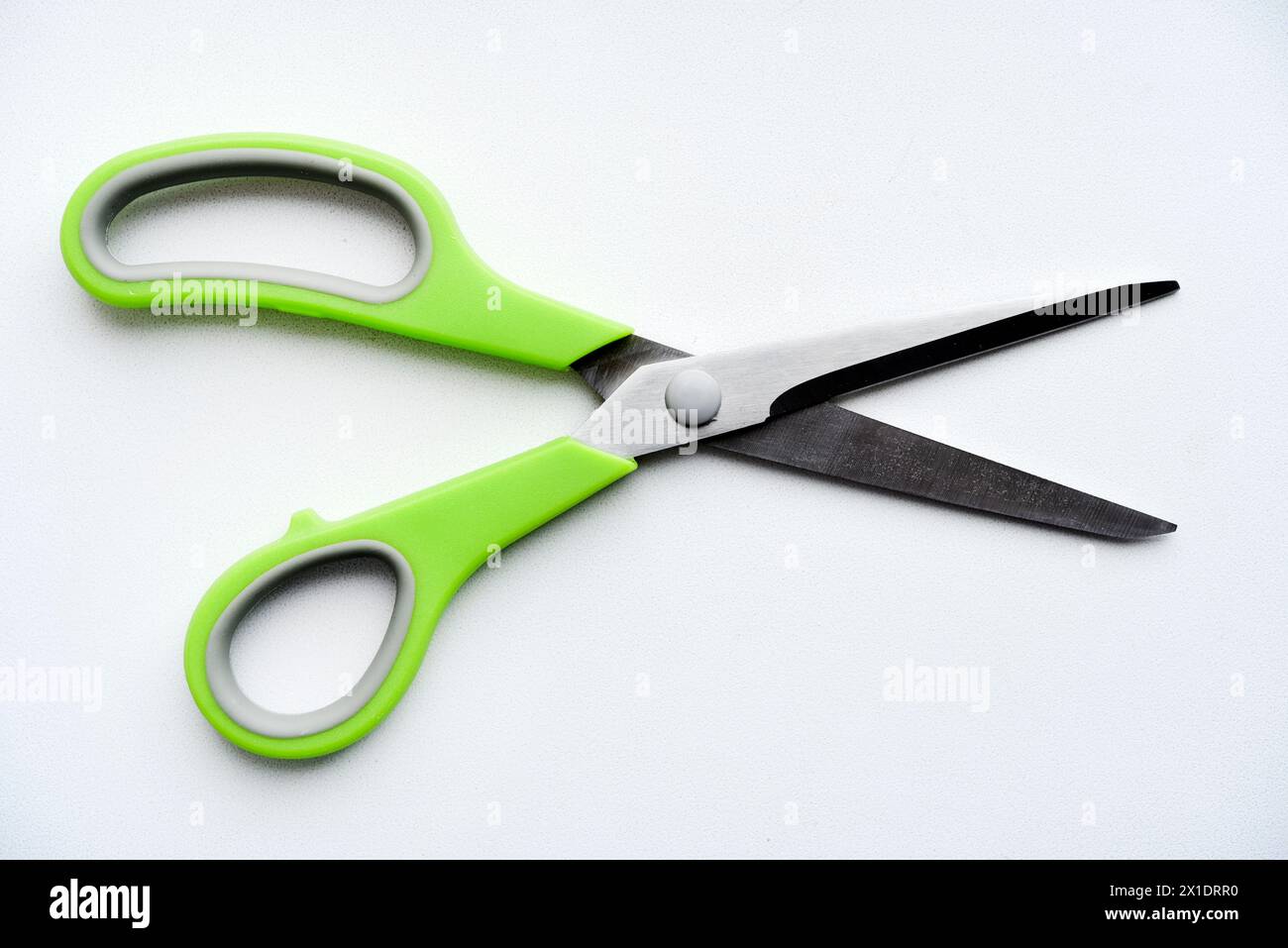 Sewing scissors on a white background. Green scissors Stock Photo - Alamy