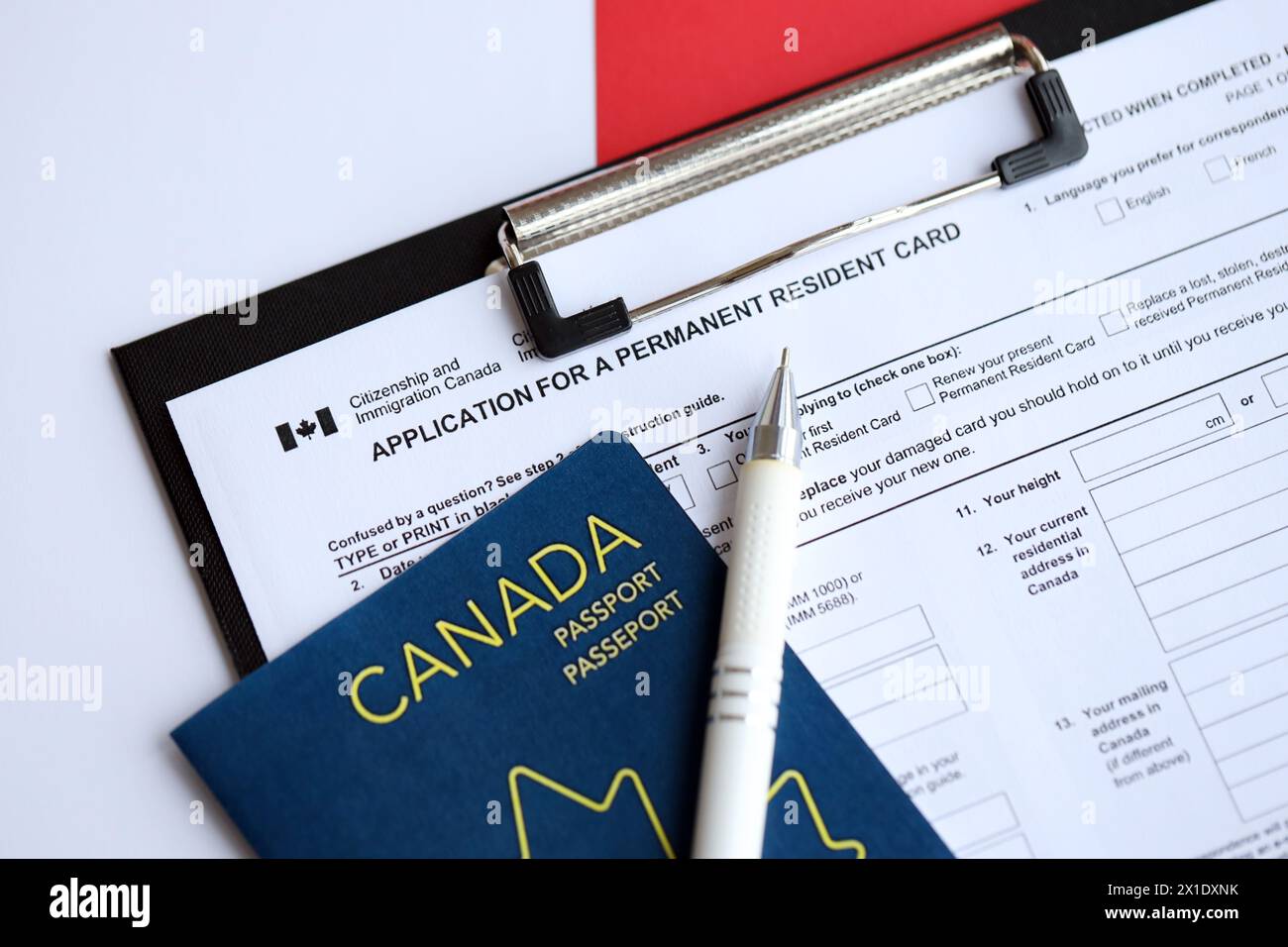 Application for permanent resident card on table with pen and canadian ...