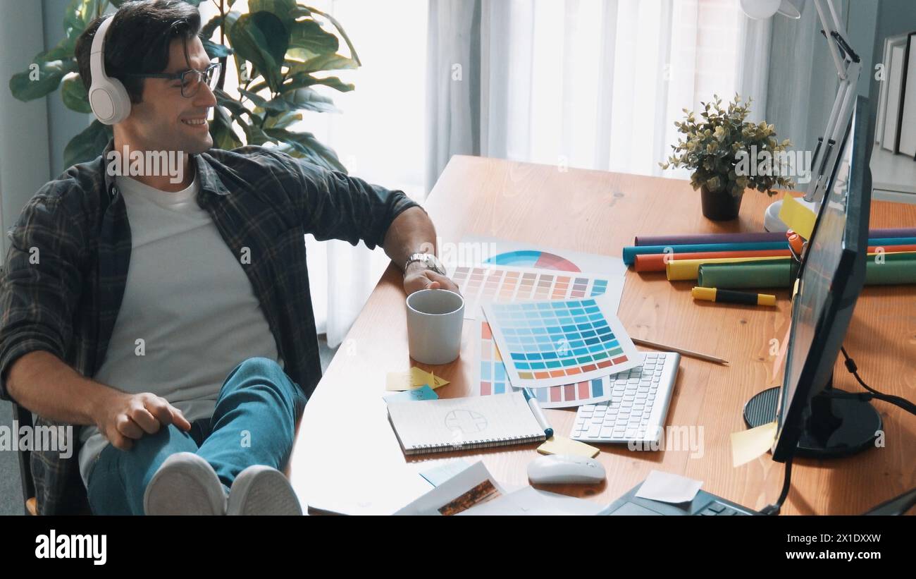 Top down aerial view of relaxed manager looking at palettes while ...