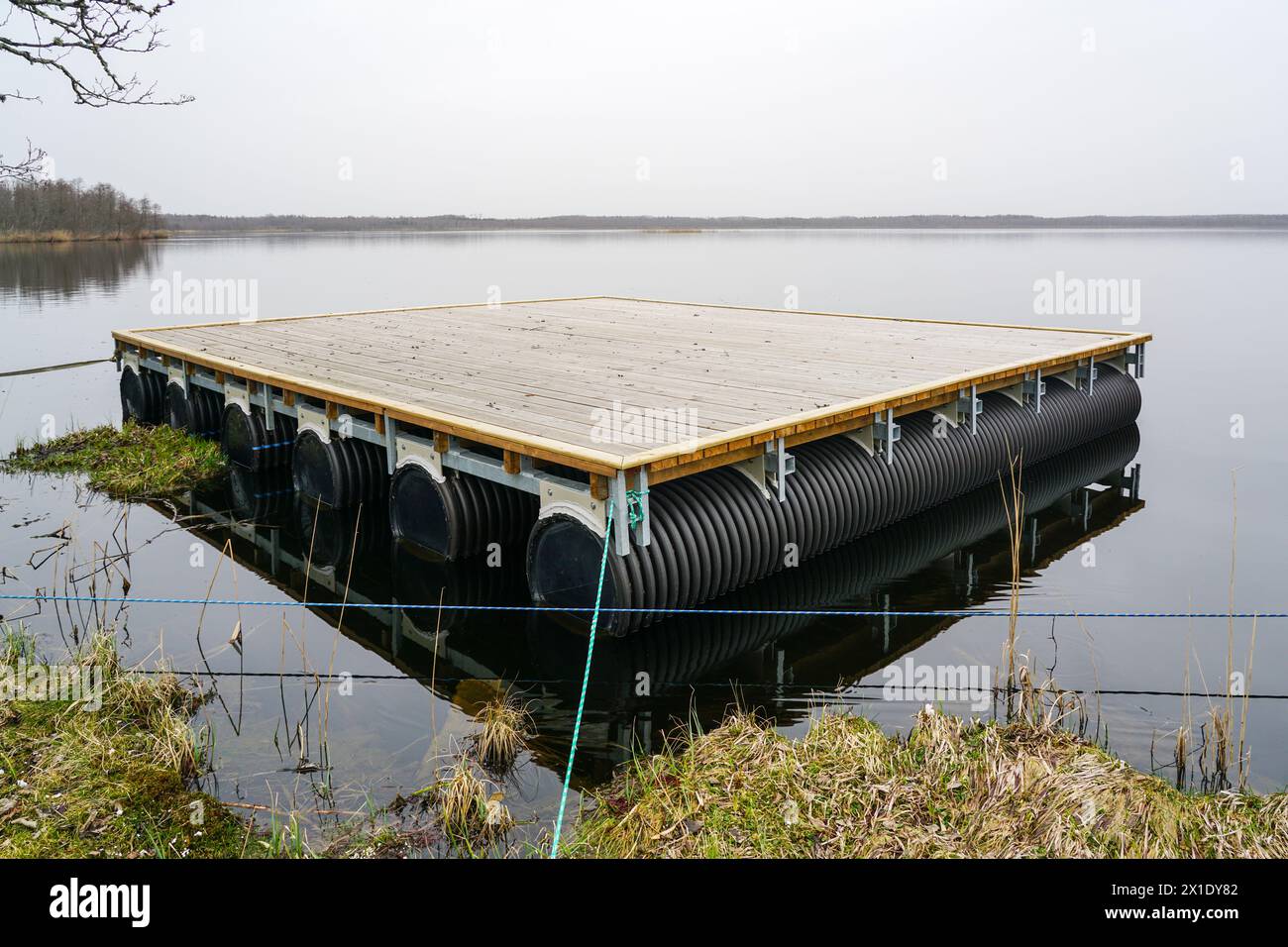 A new empty floating wooden platform on pontoons in the lake for the ...