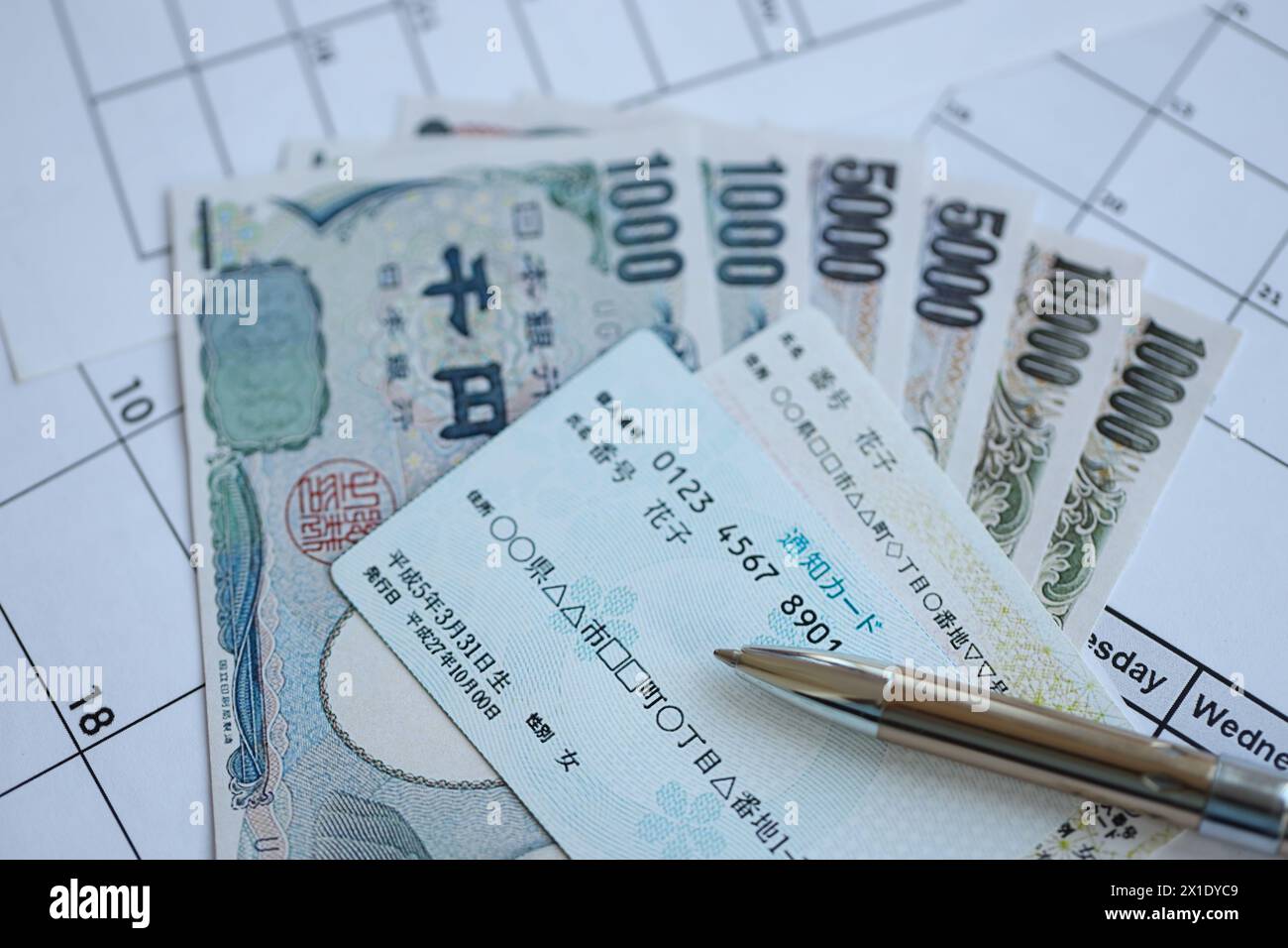 Japanese my number card specimen and notification card on calendar ...