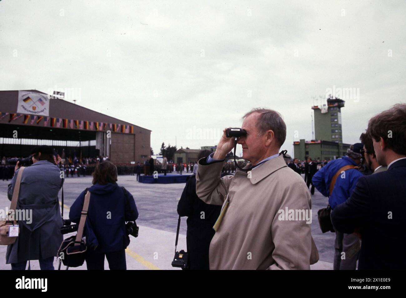Hugh Sidey on a presideential trip. Probably before an arrival ceremony ...