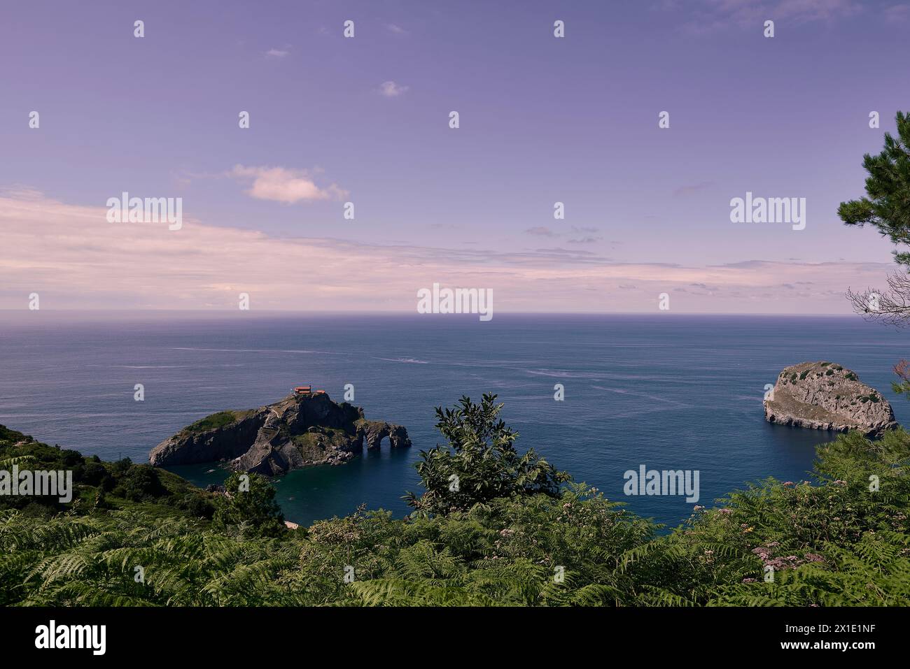 Hermitage of San Juan de Gaztelugatxe on a sunny day. calm sea, rocky ...