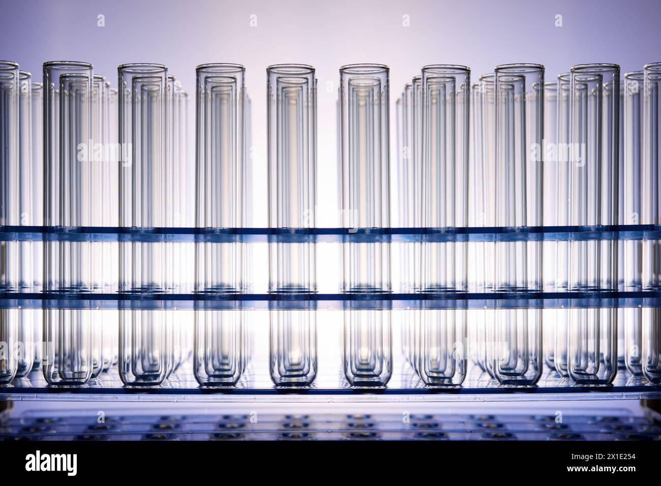 Close up of a group of empty glass test tubes standing in a laboratory ...