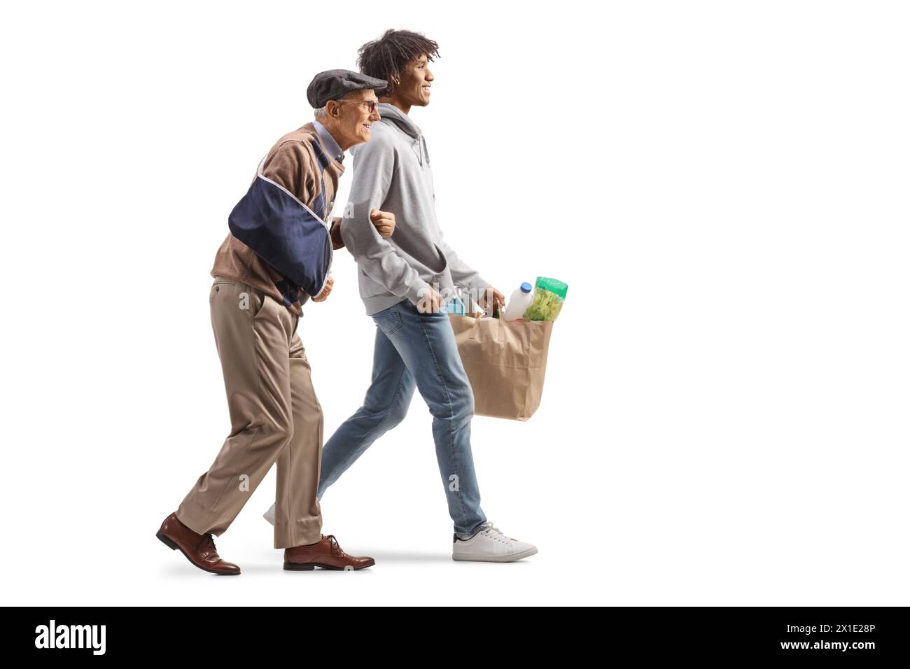 Young african american man helping a senior with a broken arm and ...