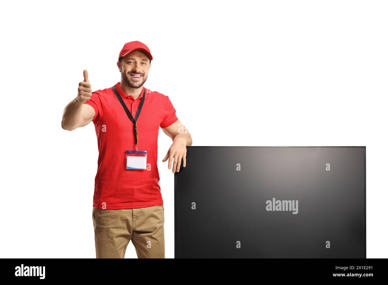 Salesman gesturing thumbs up and leaning on a flat lcd tv screen ...