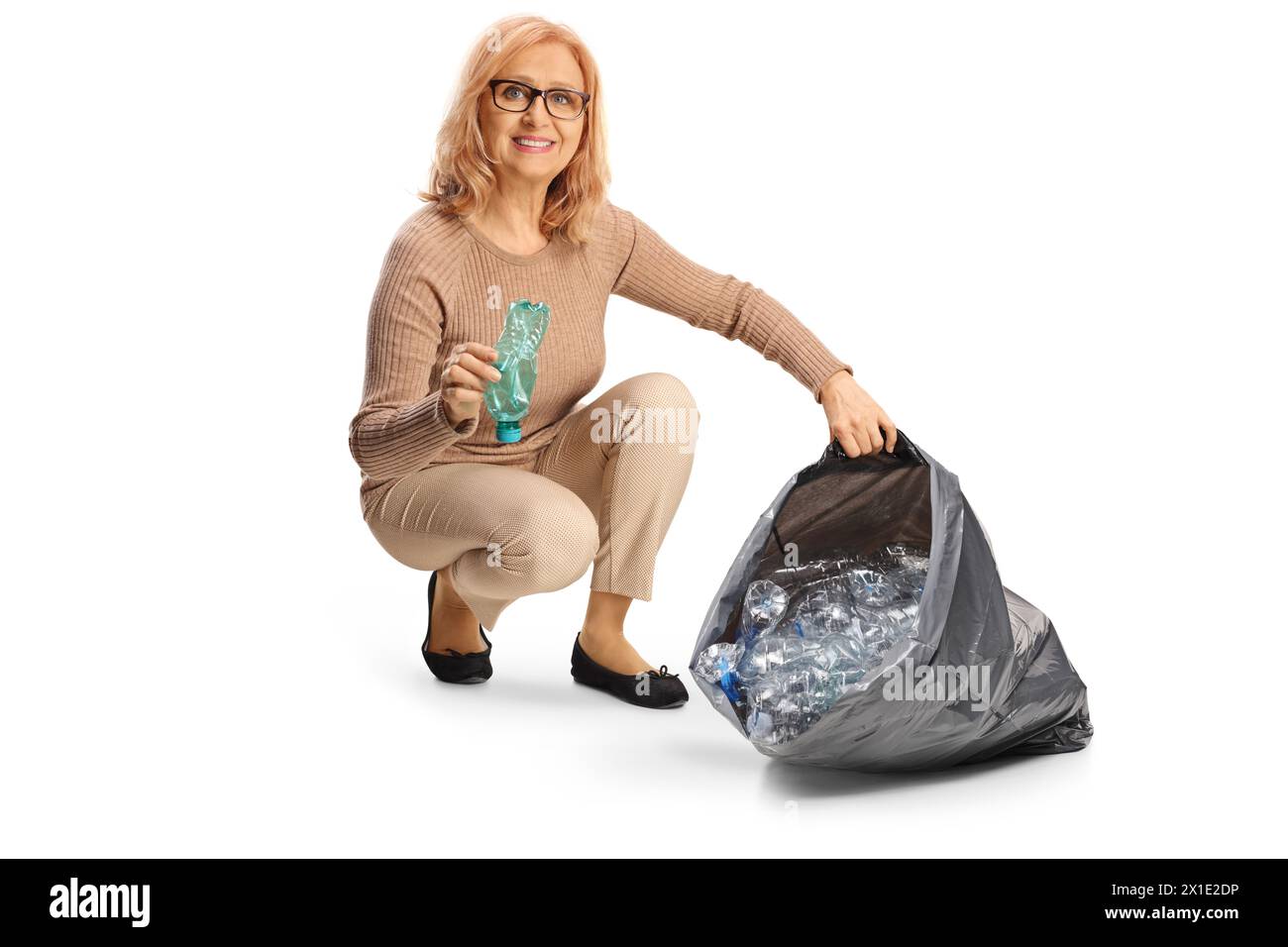 Woman collecting plastic bottles for recycling isolated on white ...