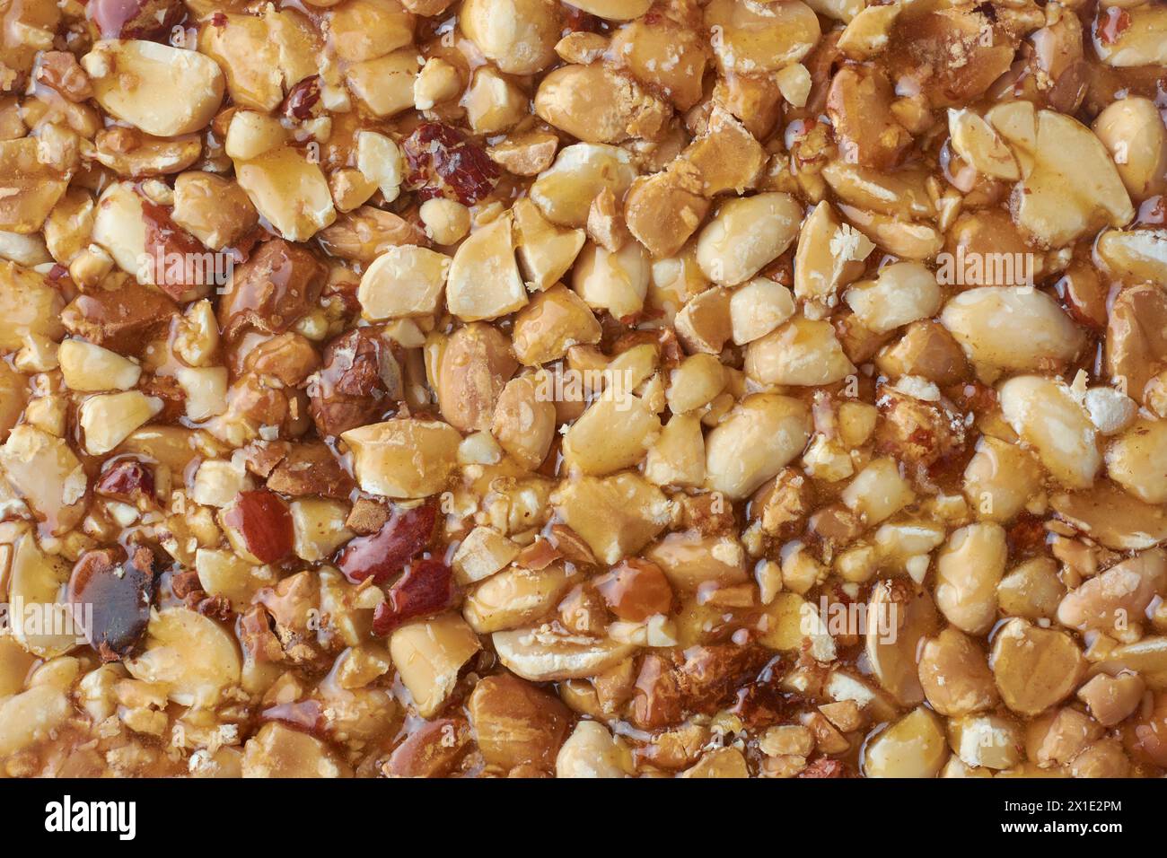 sweet peanut brittle close-up, vegetarian healthy sweet peanut in ...
