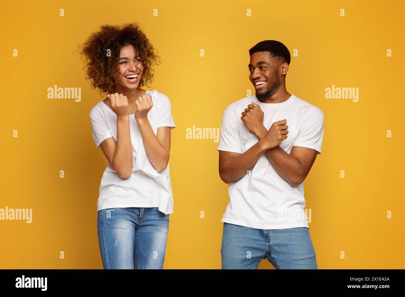 Excited couple clenching fists hi-res stock photography and images - Alamy