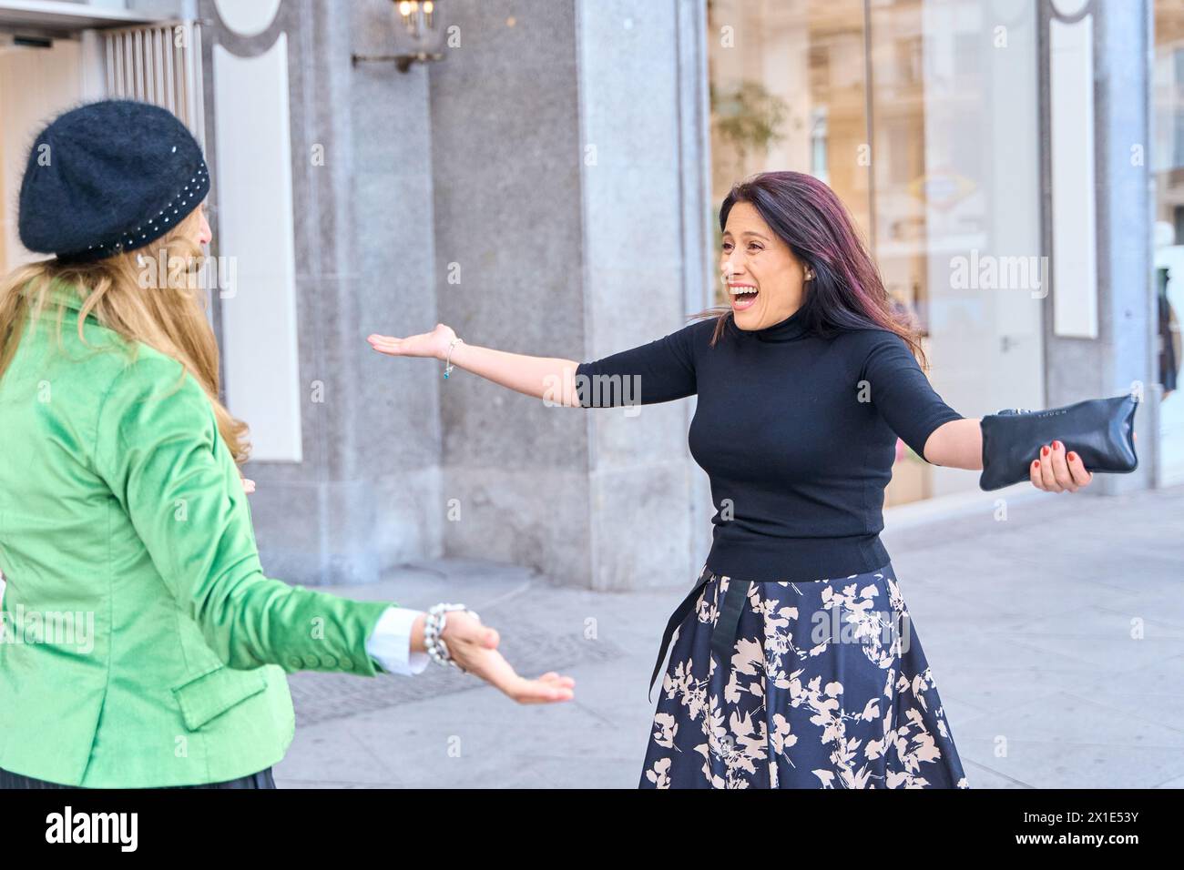 Having fun reunion. I'm back. Long time no see. Happy woman spreading ...