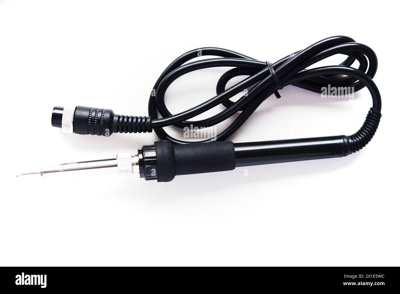 Black plastic soldering iron on a white background Stock Photo - Alamy