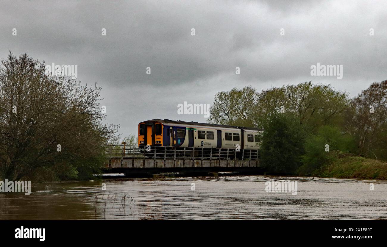 A spring high tide is filling the River Douglas as a train from Preston ...