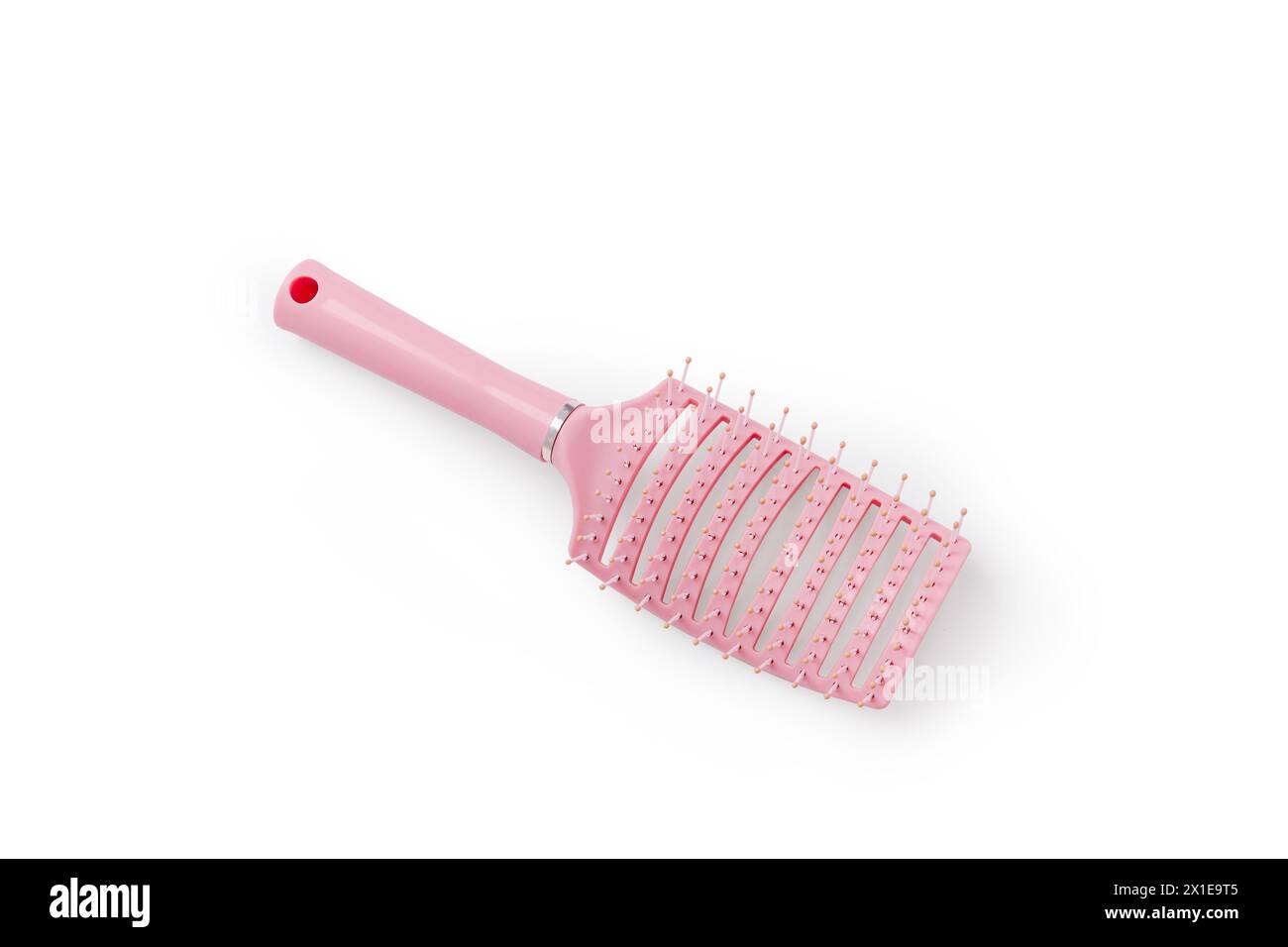 A pink plastic comb with a handle on a white background Stock Photo - Alamy