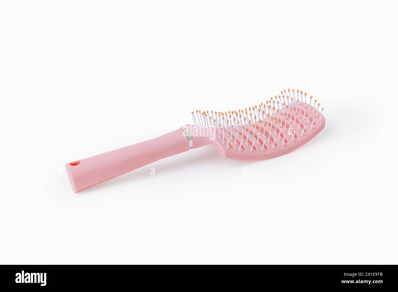 A pink plastic comb with a handle on a white background Stock Photo - Alamy
