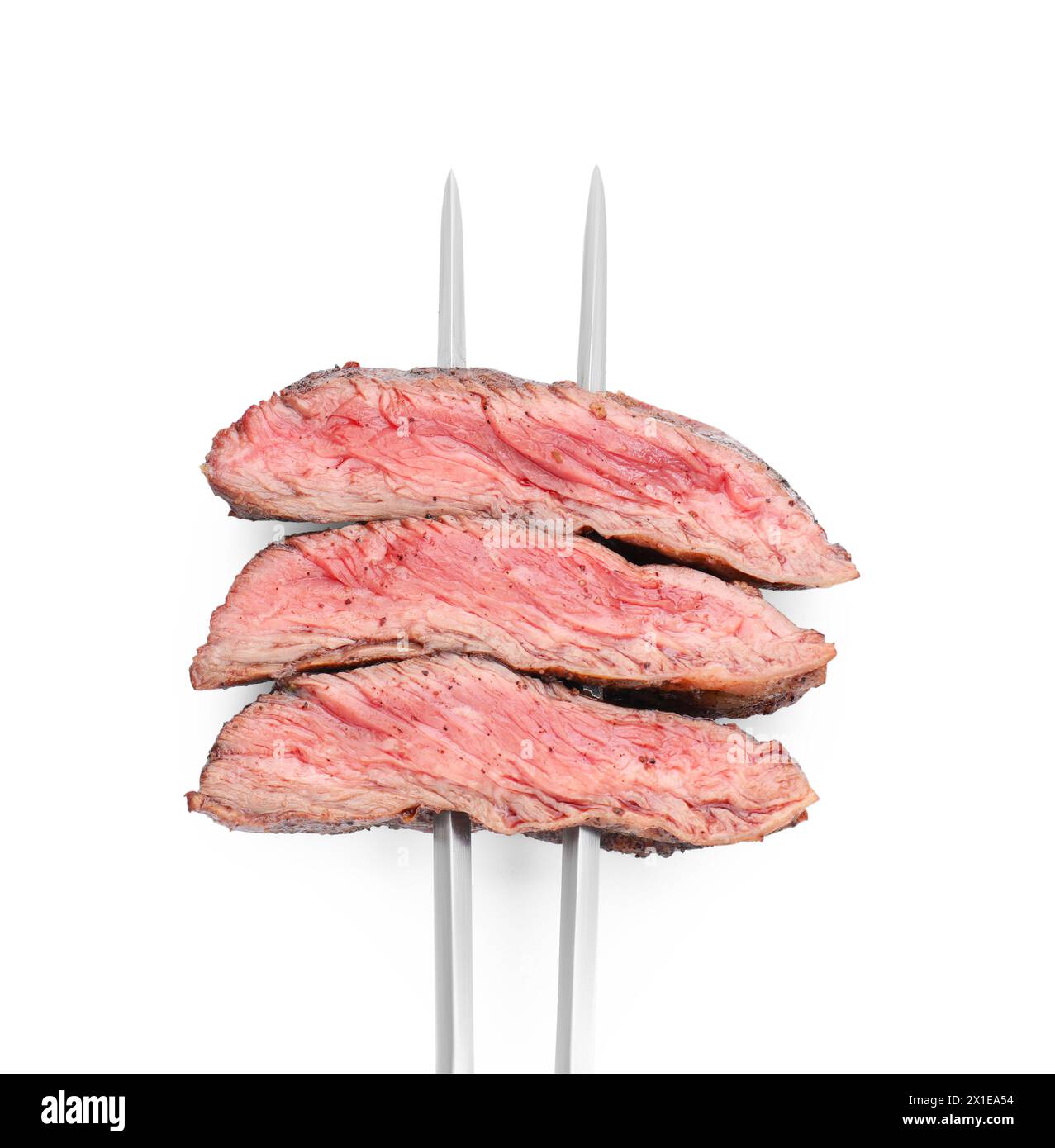 Meat fork with grilled beef pieces isolated on white, top view Stock ...