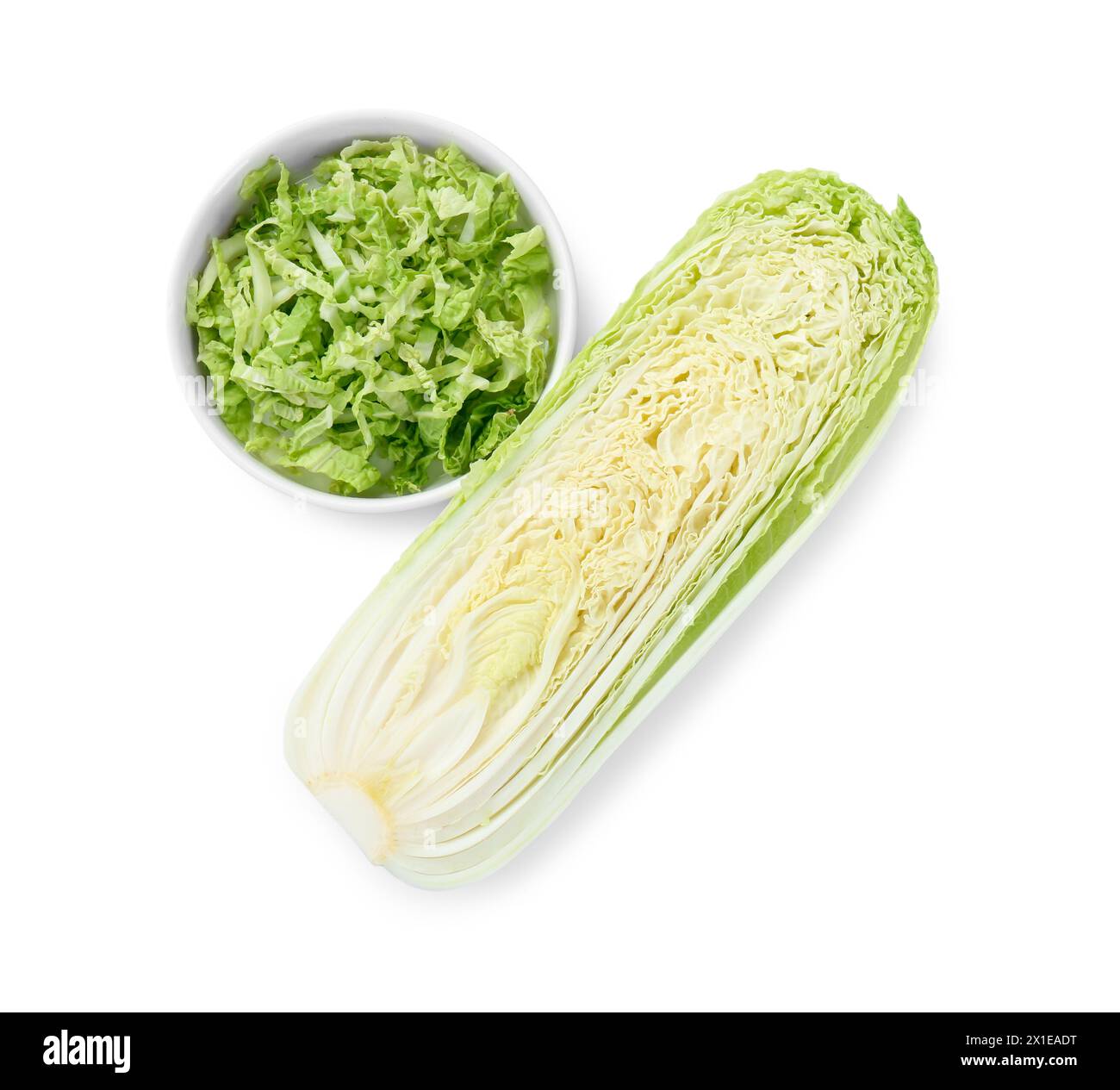 Shredded fresh Chinese cabbage in bowl and whole one isolated on white ...