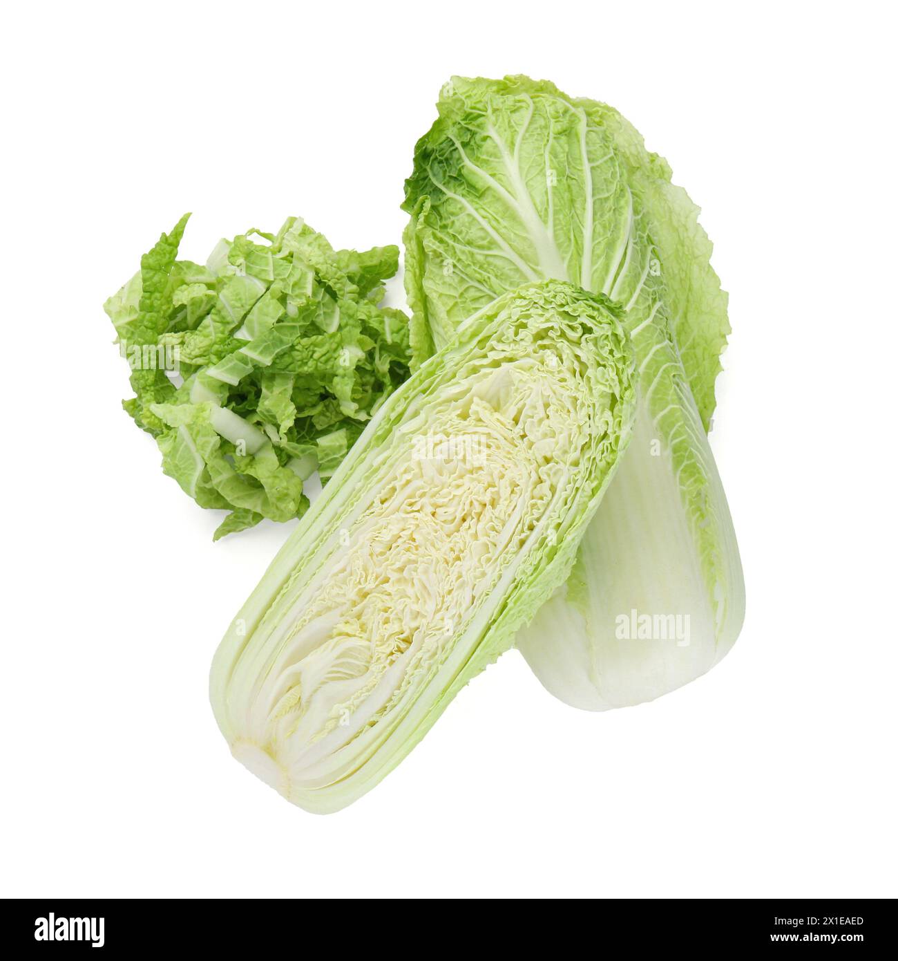 Pile of shredded fresh Chinese cabbage and halves of one isolated on ...
