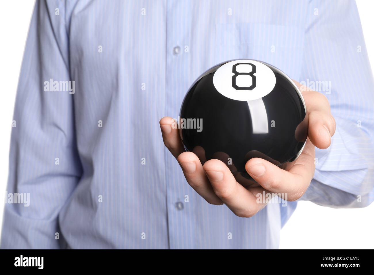 Man holding magic eight ball on white background, closeup Stock Photo ...