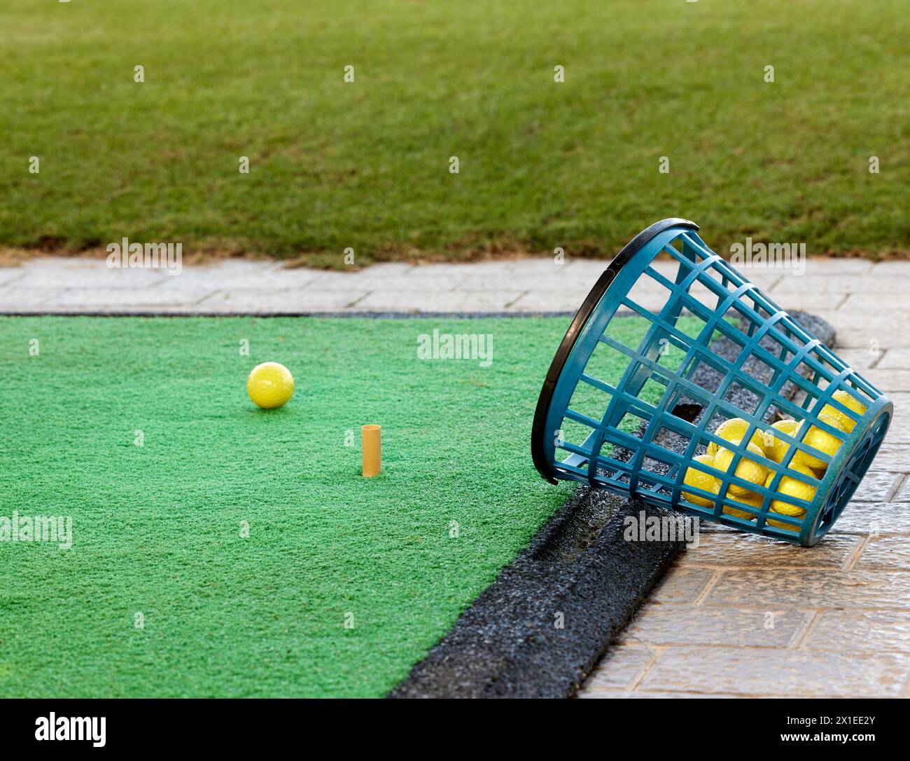 Basket of golf balls on the driving range Stock Photo - Alamy