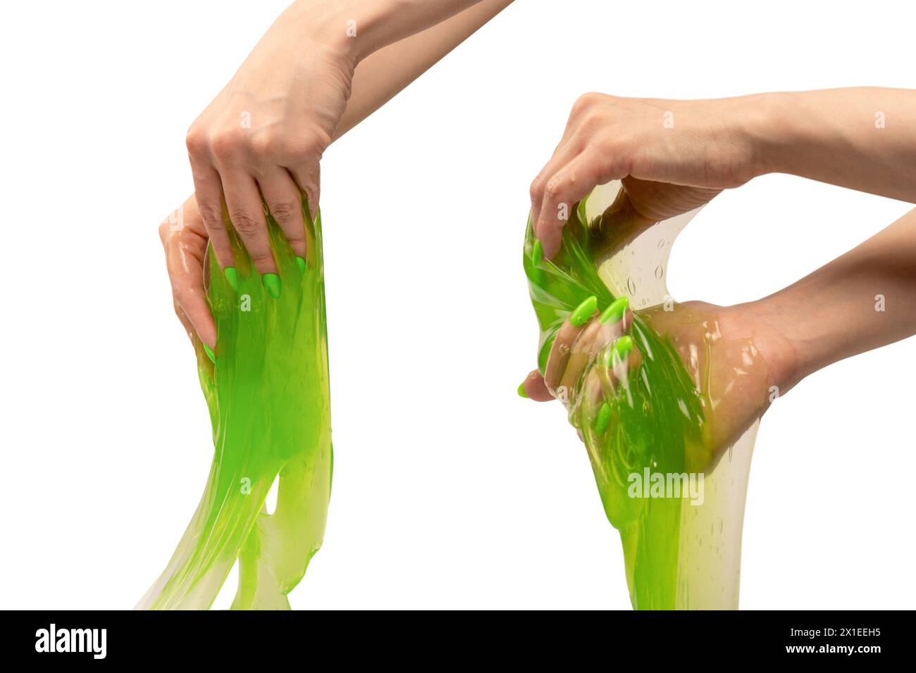 Green slime toy in woman hand with green nails isolated on a white ...