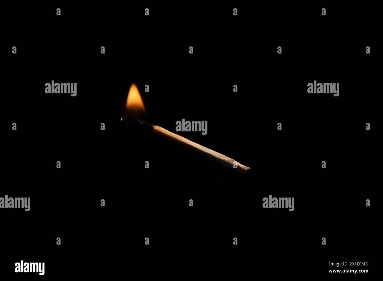 Lit and falling match on a black background Stock Photo - Alamy