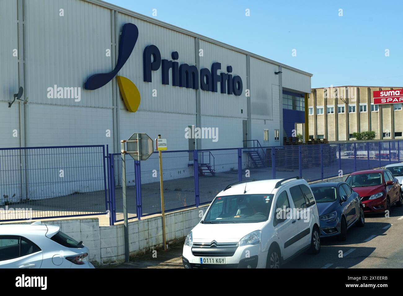 Figueres, Spain - May 24, 2023: Parked cars line outside the entrance ...
