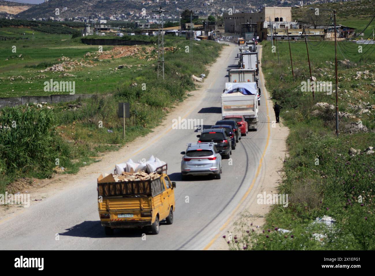 Nablus, Palestine. 16th Apr, 2024. A queue of Palestinian vehicles wait ...