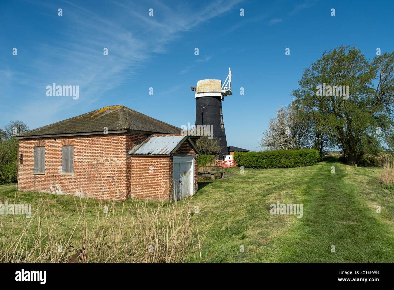 Upton, Norfolk, UK – April 14 2024. Tall Mill Tower drainage mill on ...