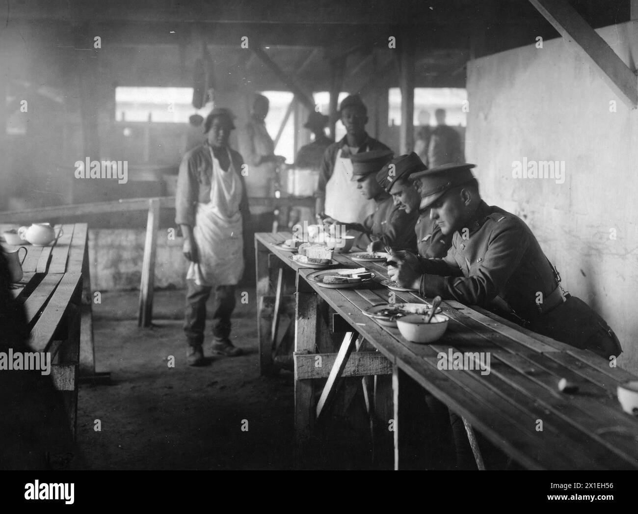 With the A.E.F. in France. Interior view of soldiers eating at a mess ...