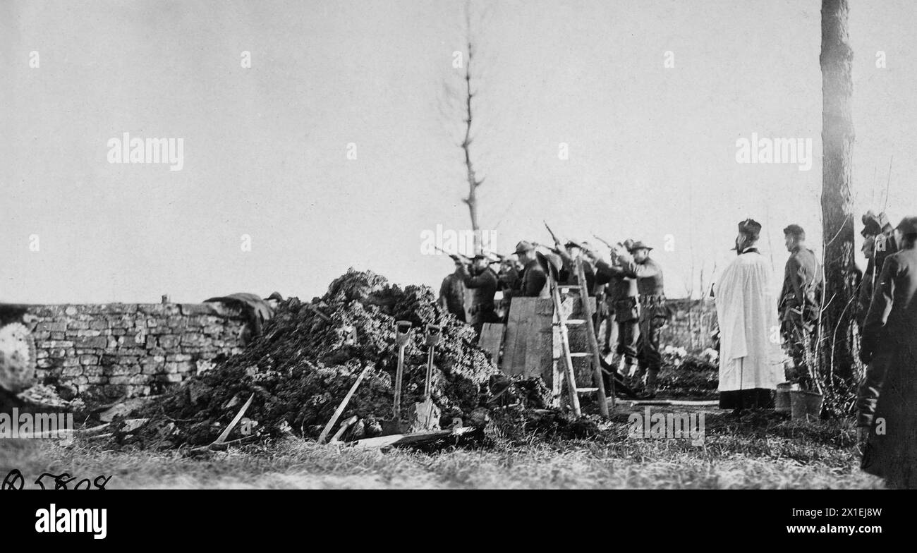 Soldiers firing a volley over the grave of a fallen Marine; Bruvans ...