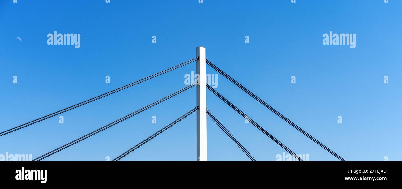 Construction elements of pylon cable-stayed bridge in front of blue sky ...