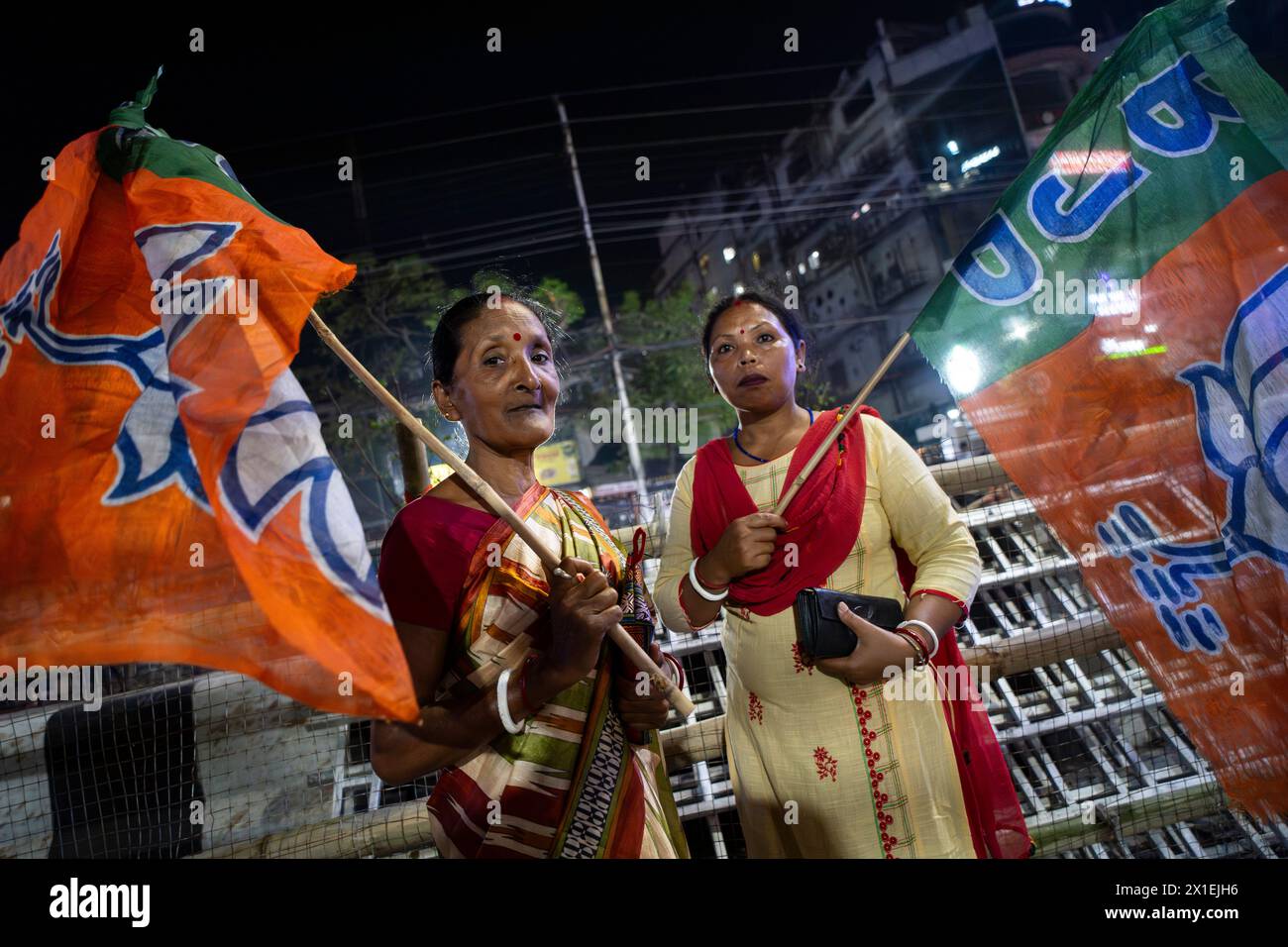 Bharatiya Janata Party (BJP) supporters holding BJP party flag waiting ...