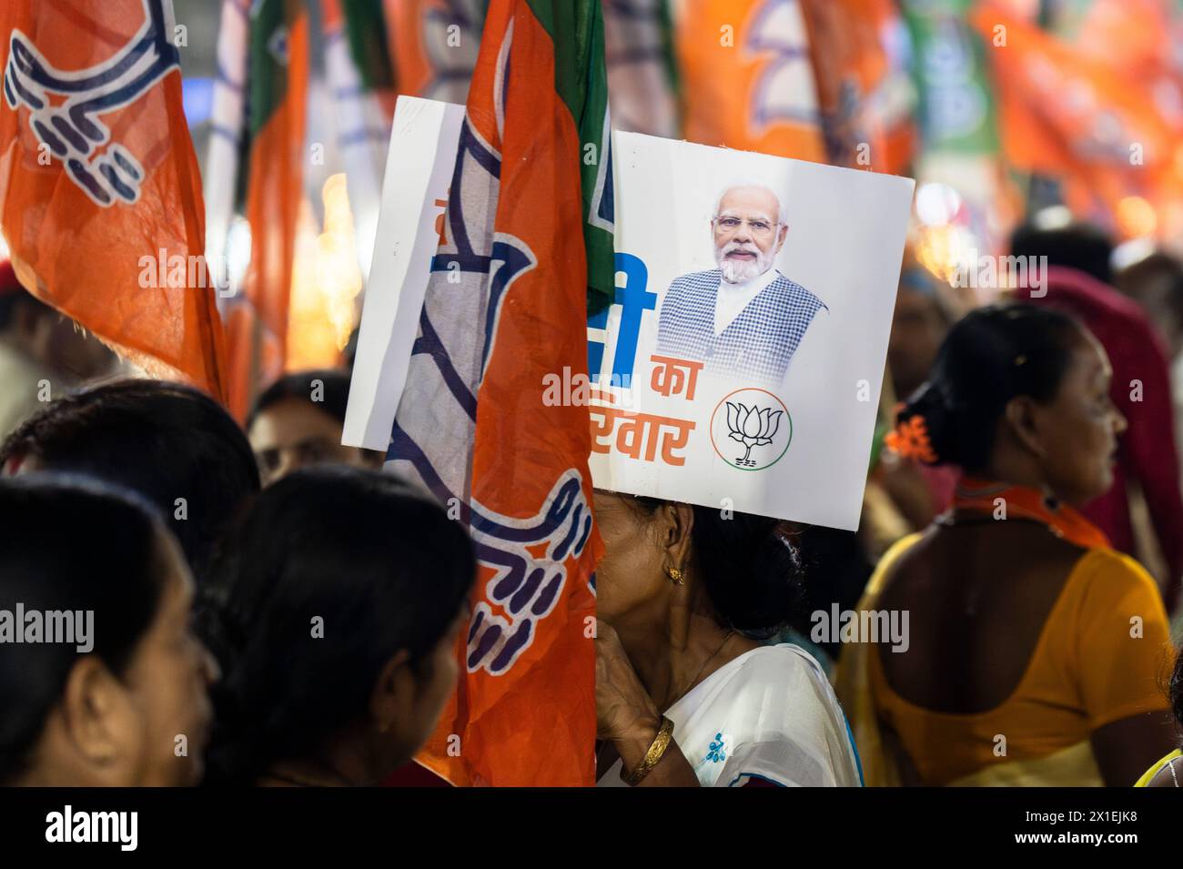 Bharatiya Janata Party (BJP) supporters holding BJP party flag waiting ...