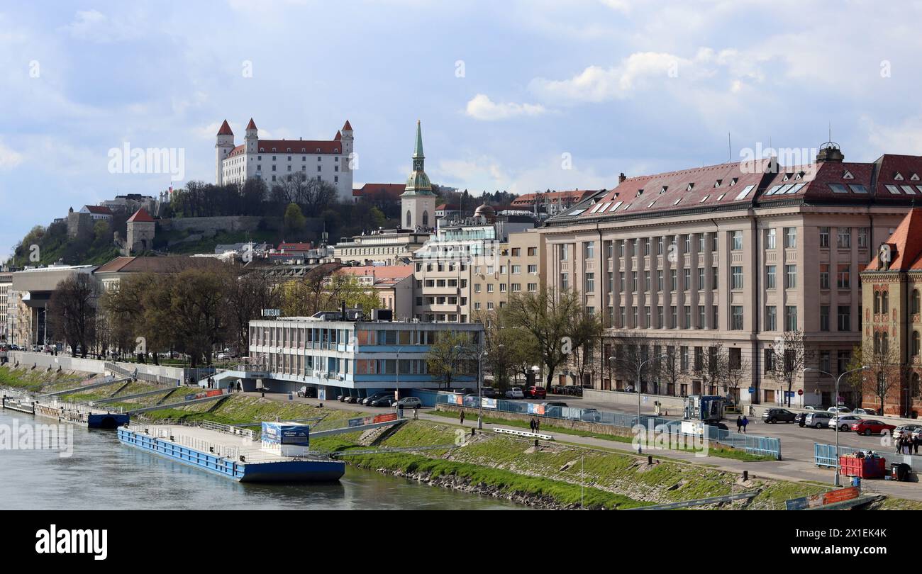 Bratislava old town panoramic view from Danube river. Bratislava castle on cloudy day. European ...