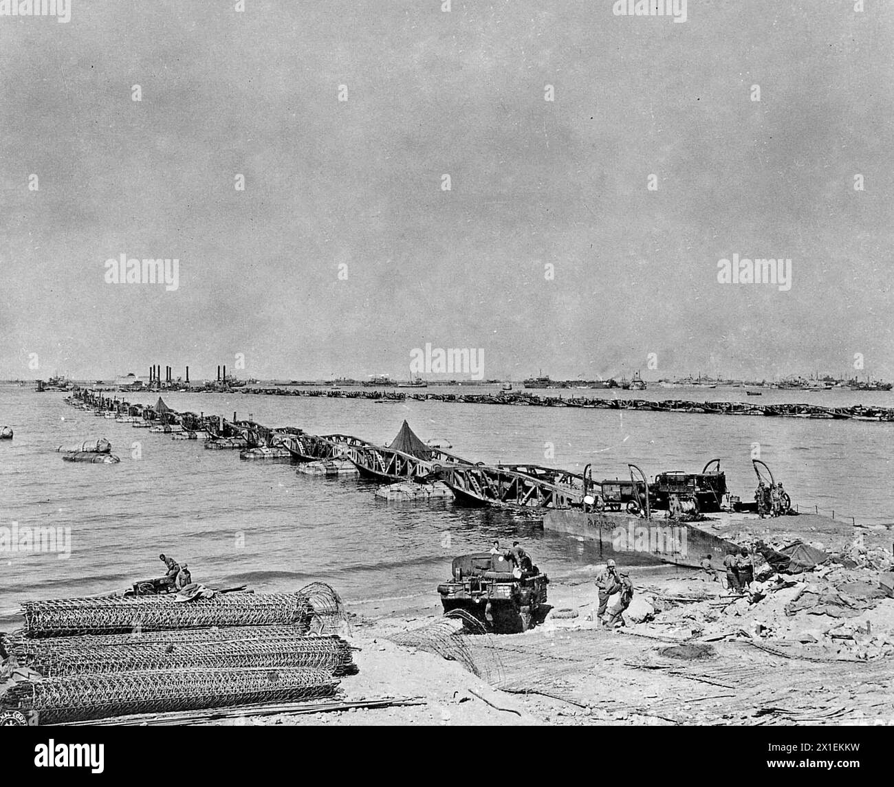 Original Caption: "These improvised landing platforms, extending into ...